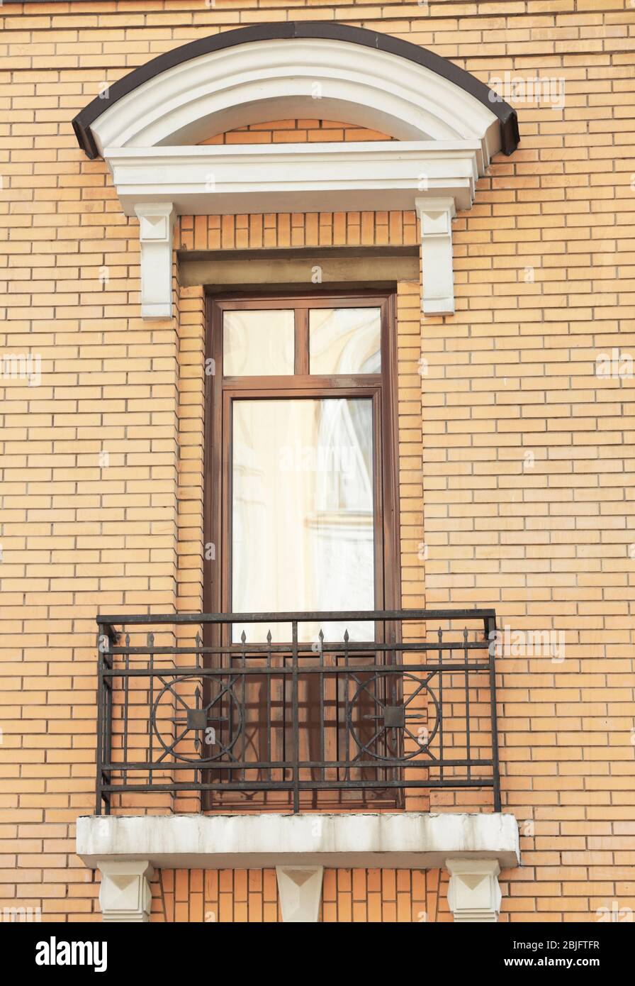 Brick building with tall window Stock Photo - Alamy
