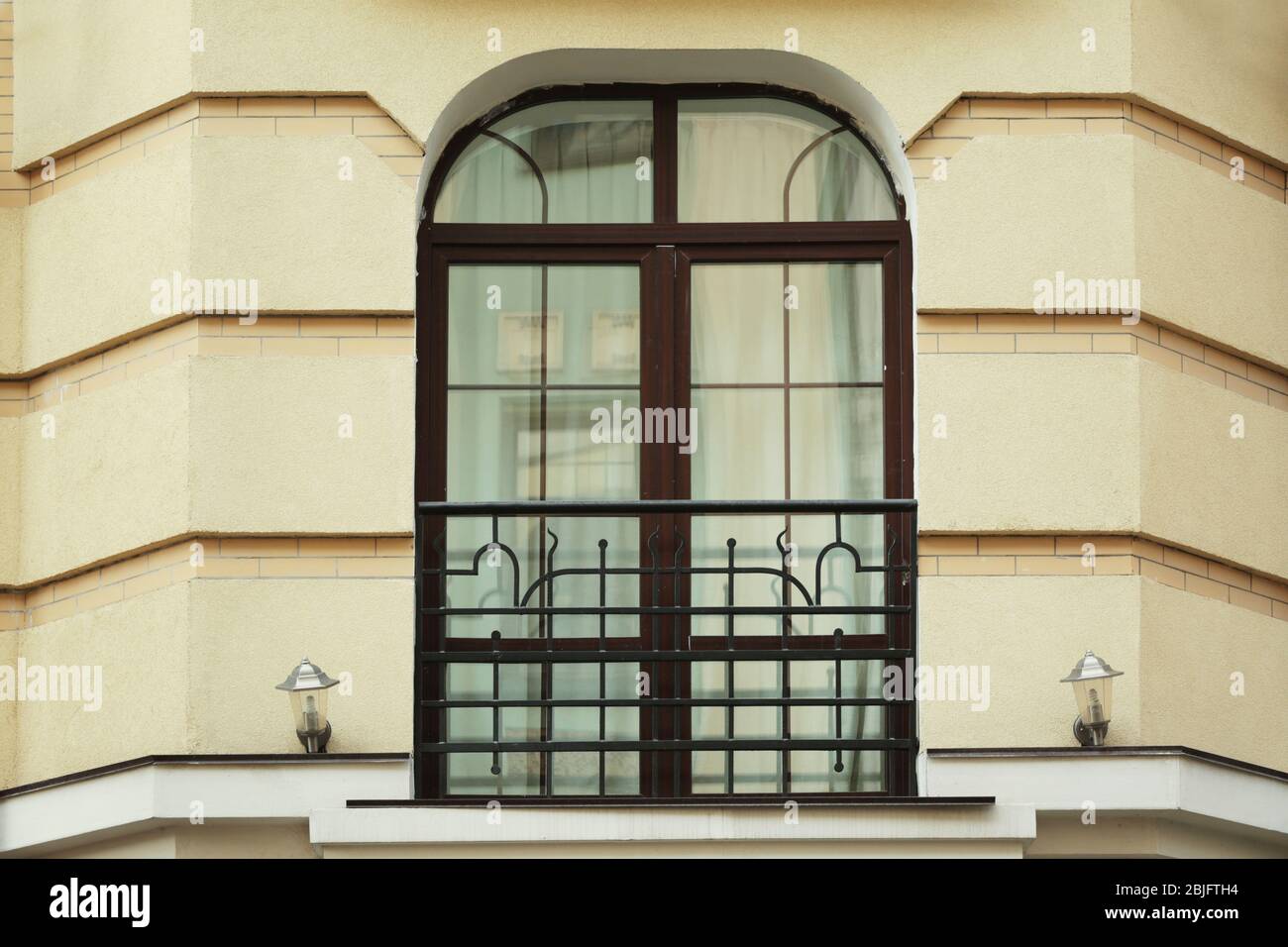 Arched window with sand wall background Stock Photo - Alamy