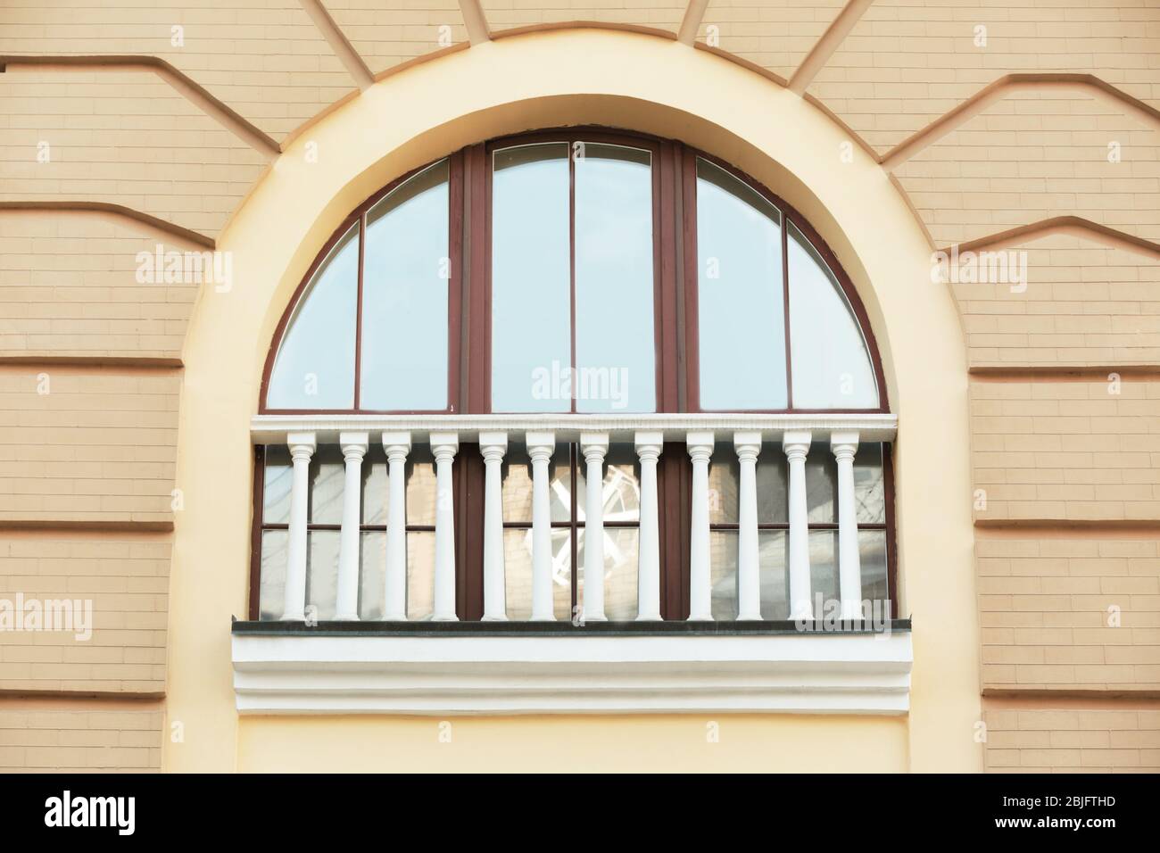 Arched window with sand wall background Stock Photo - Alamy