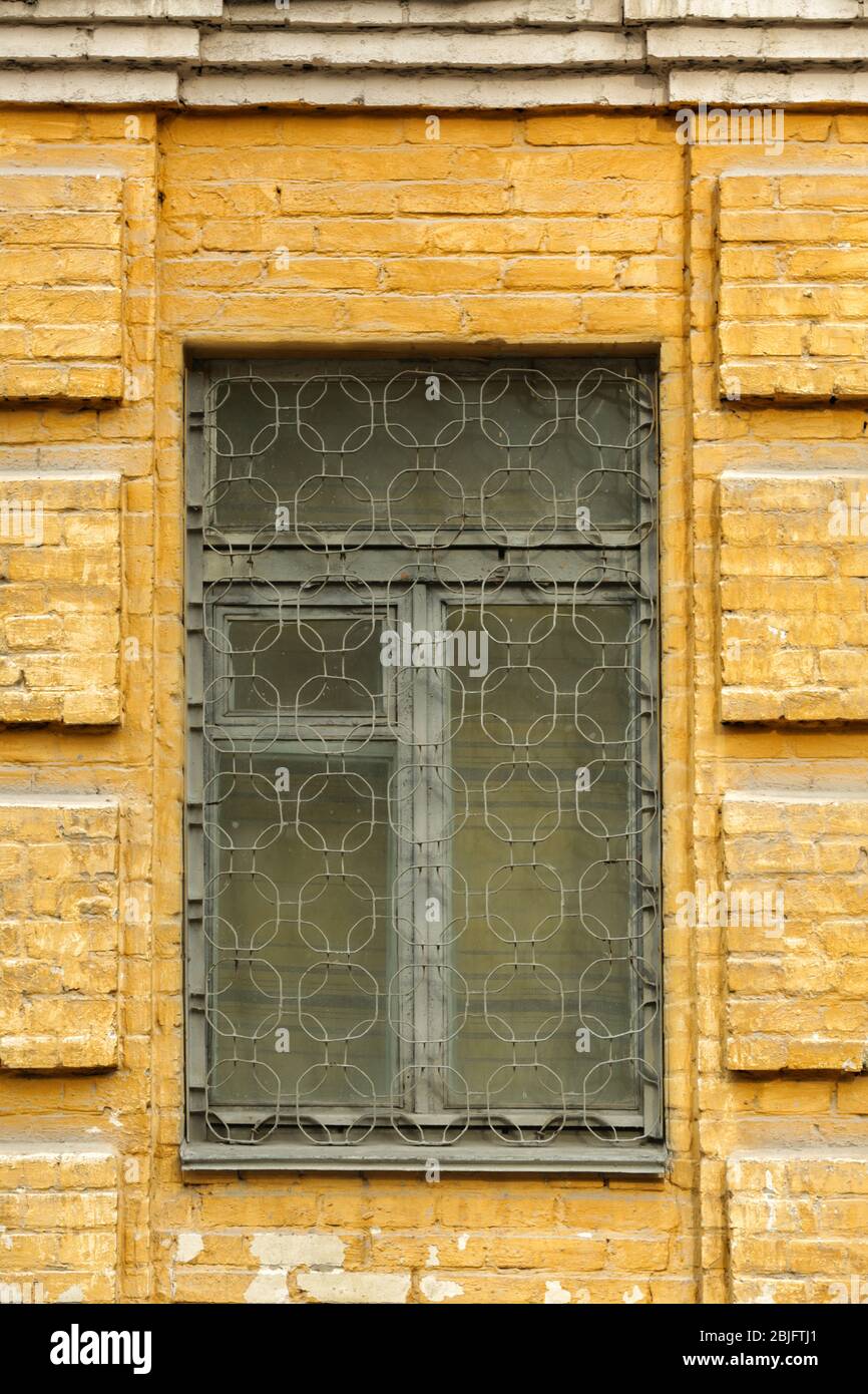 Vintage window and forging with brick wall background Stock Photo - Alamy