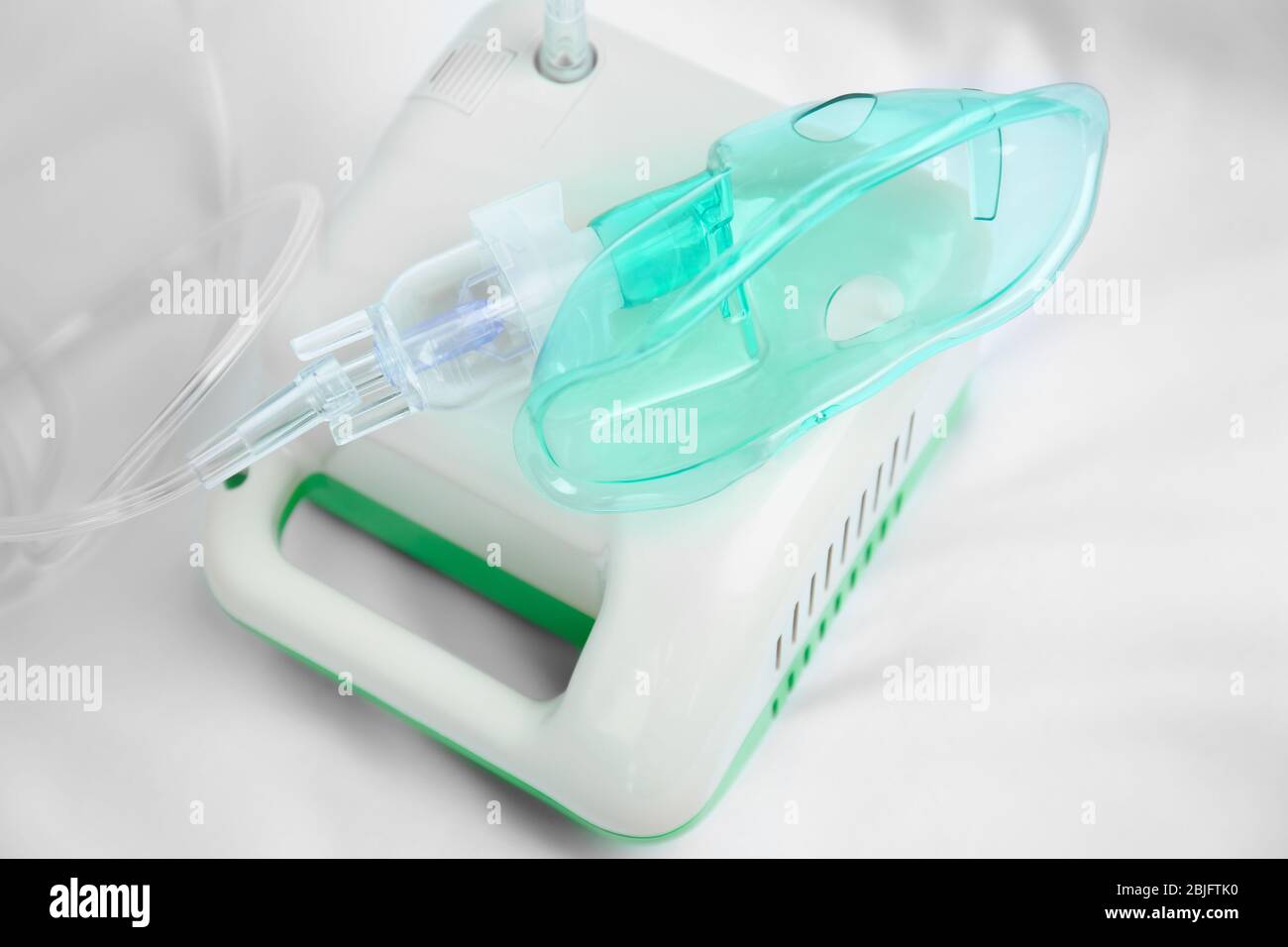 Compressor nebulizer with mask on white background Stock Photo - Alamy