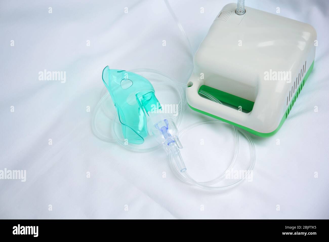 Compressor nebulizer with mask on white background Stock Photo - Alamy