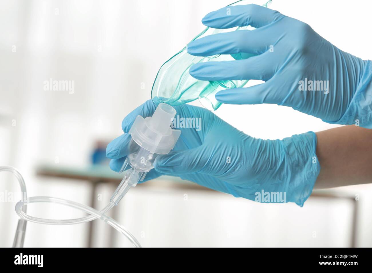 Doctor preparing compressor nebulizer for use Stock Photo - Alamy