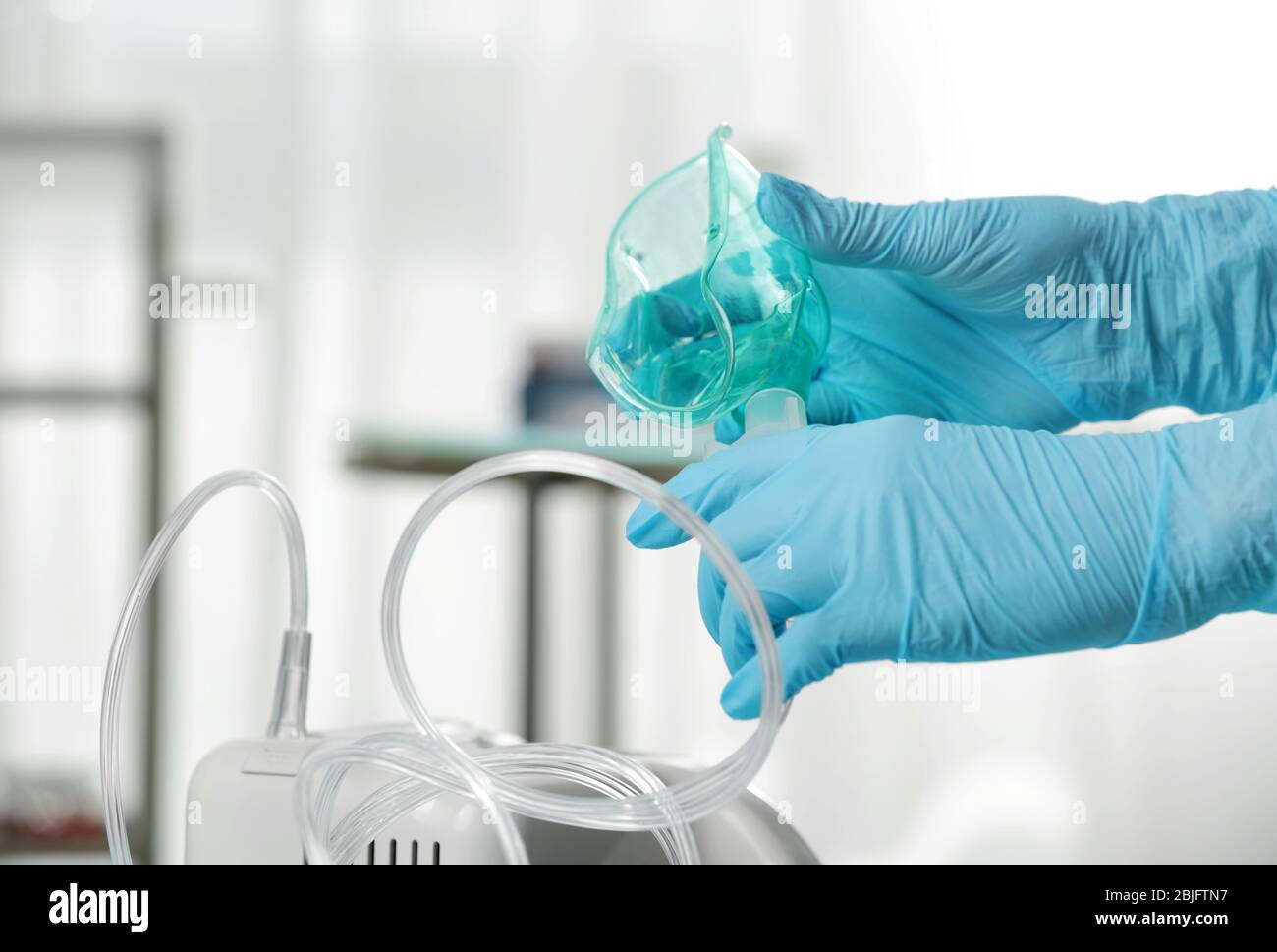 Doctor preparing compressor nebulizer for use Stock Photo - Alamy