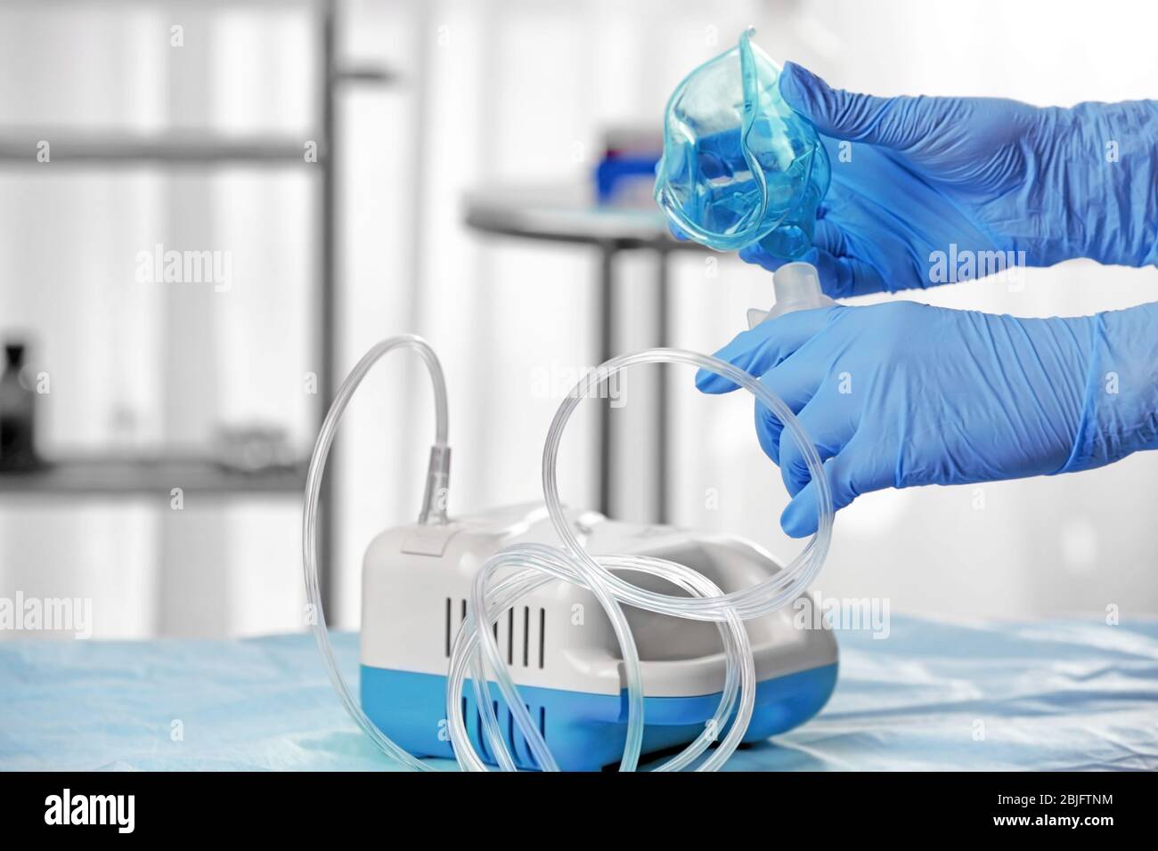 Doctor preparing compressor nebulizer for use Stock Photo - Alamy