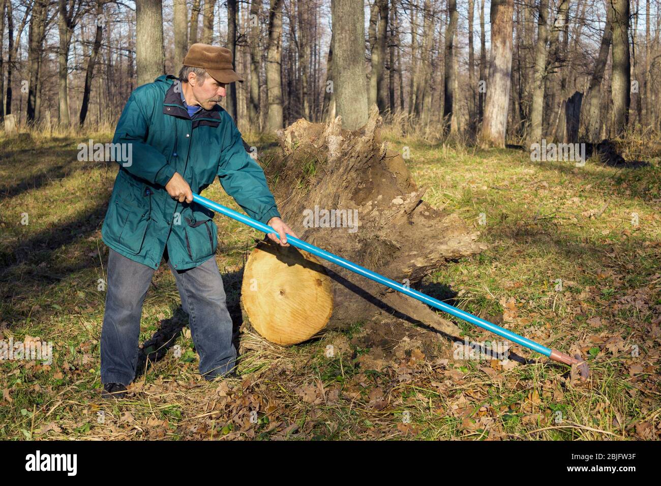 Old man raking hi-res stock photography and images - Alamy