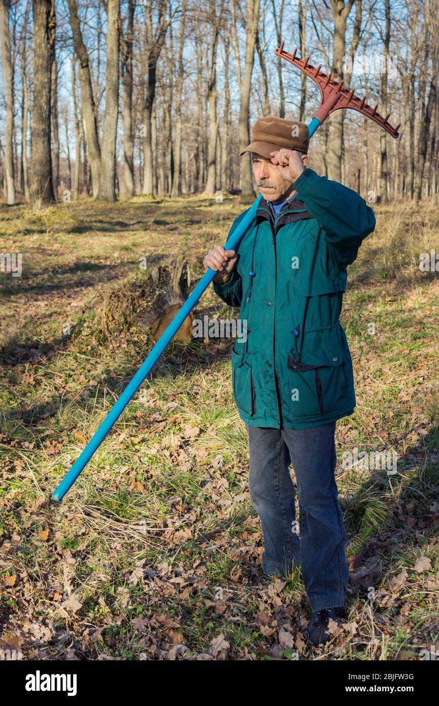 Old Man Raking Grass High Resolution Stock Photography and Images - Alamy