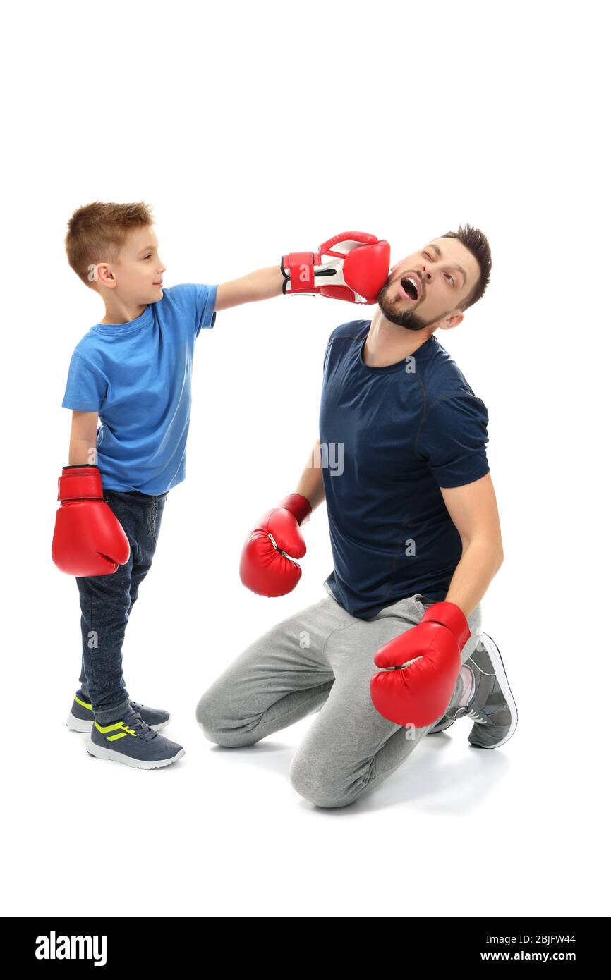 Father and son during boxing training, on white background Stock Photo ...