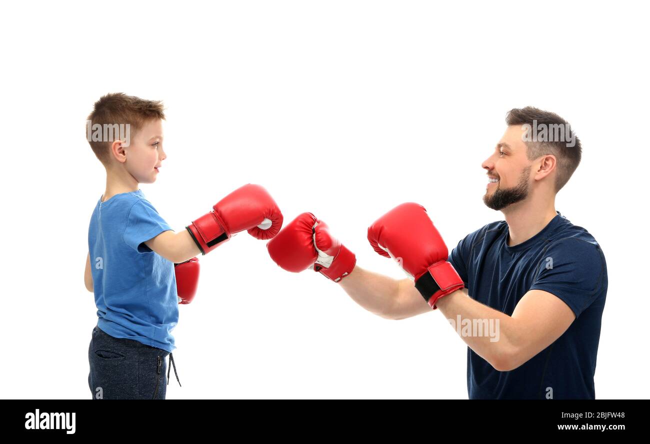 Father and son during boxing training, on white background Stock Photo ...
