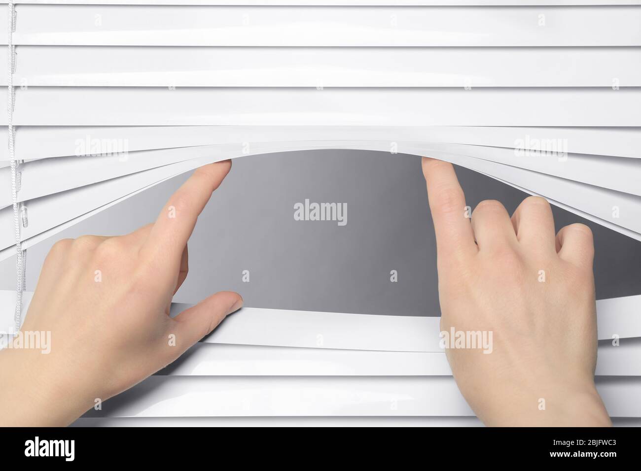 Human hands opening blinds Stock Photo - Alamy