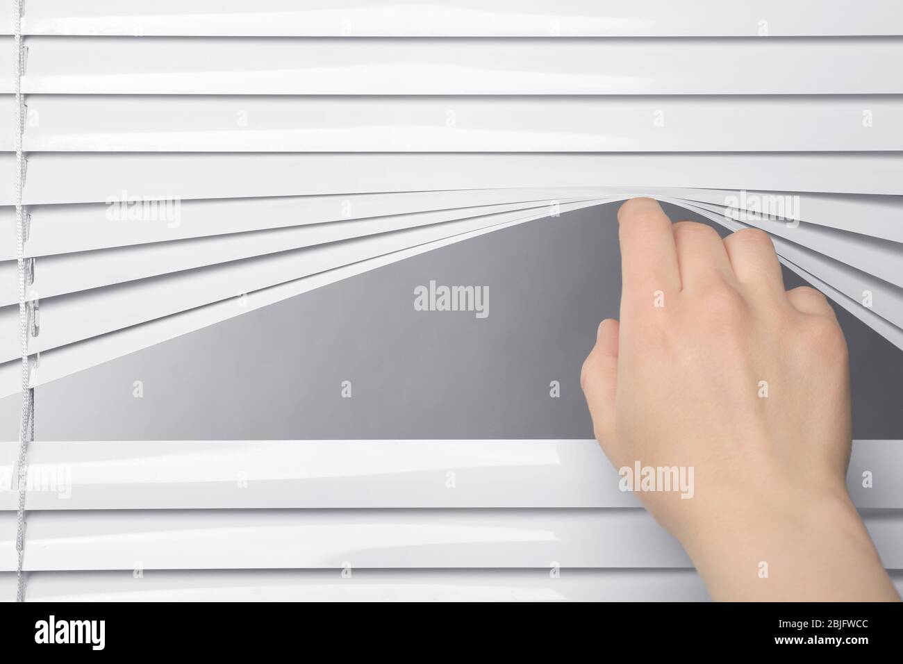 Human hand opening blinds Stock Photo - Alamy