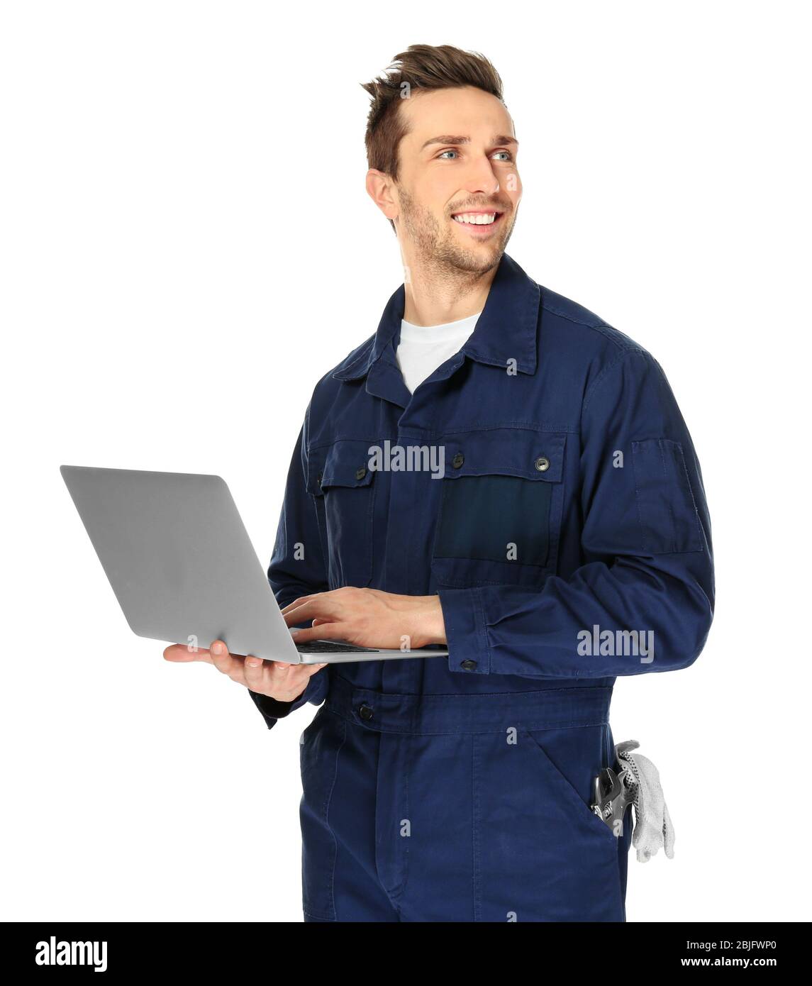 Handsome auto mechanic with laptop on white background Stock Photo - Alamy