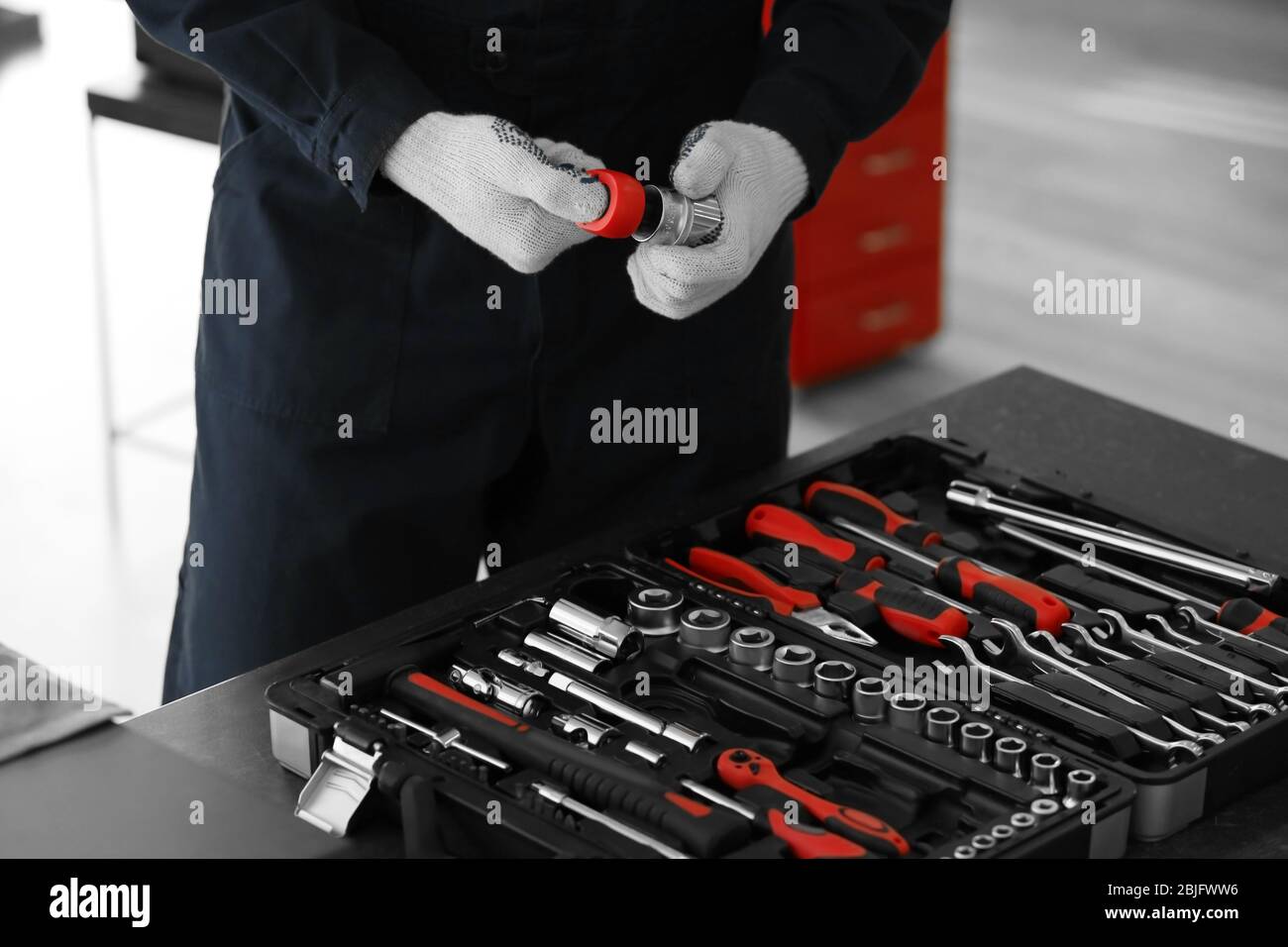 Auto mechanic with tools in car repair shop, closeup Stock Photo - Alamy
