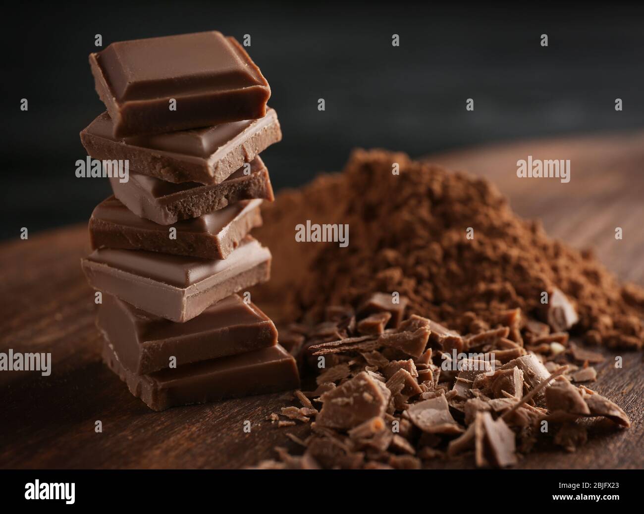 Stack of chocolate pieces on table, closeup Stock Photo - Alamy