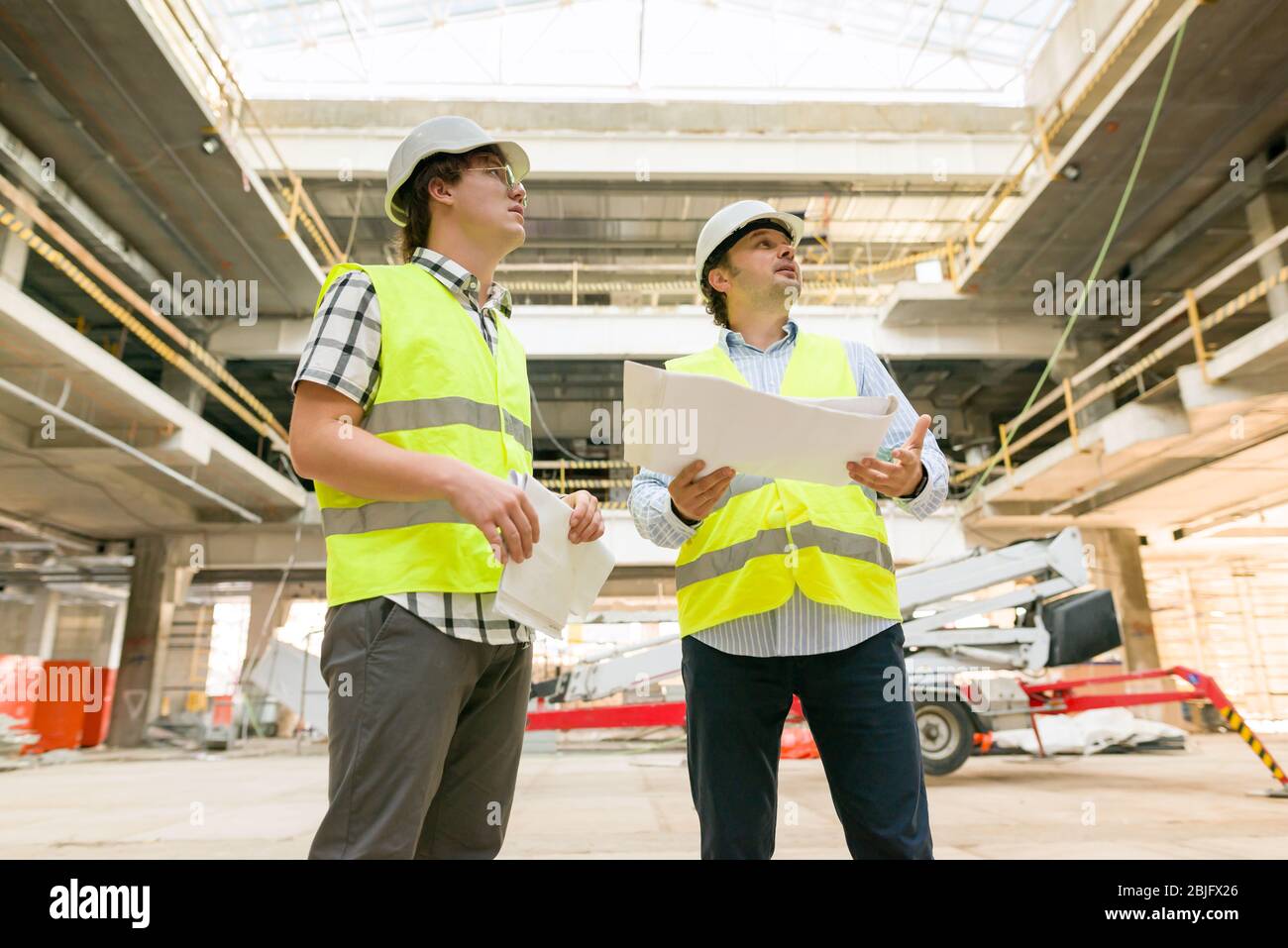 Two business builder people at construction site Stock Photo - Alamy