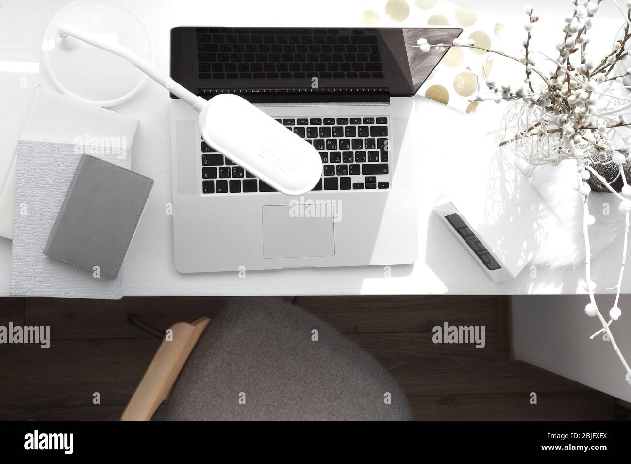 Creative workplace with laptop on windowsill in modern room Stock Photo ...
