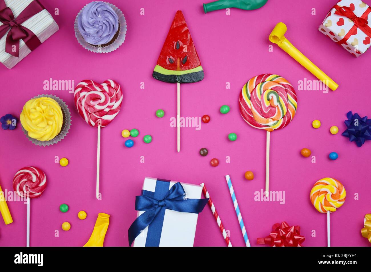 Bright birthday background with sweets and decorations Stock Photo - Alamy