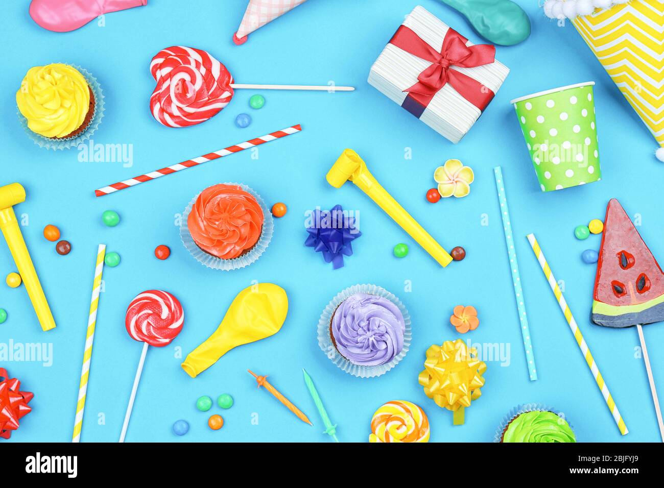 Bright birthday background with sweets and decorations Stock Photo - Alamy