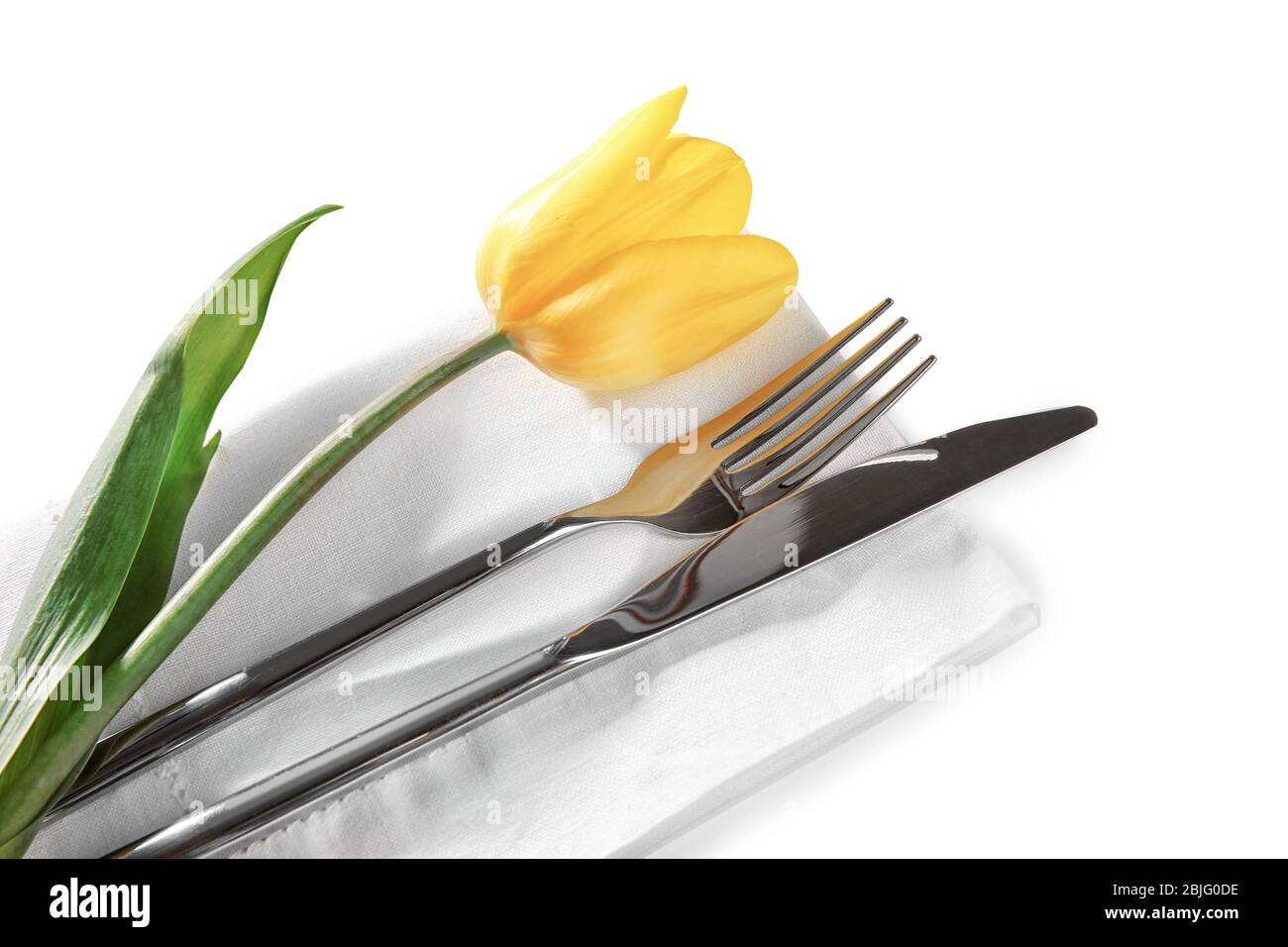 Cutlery set with beautiful flower on white background Stock Photo - Alamy
