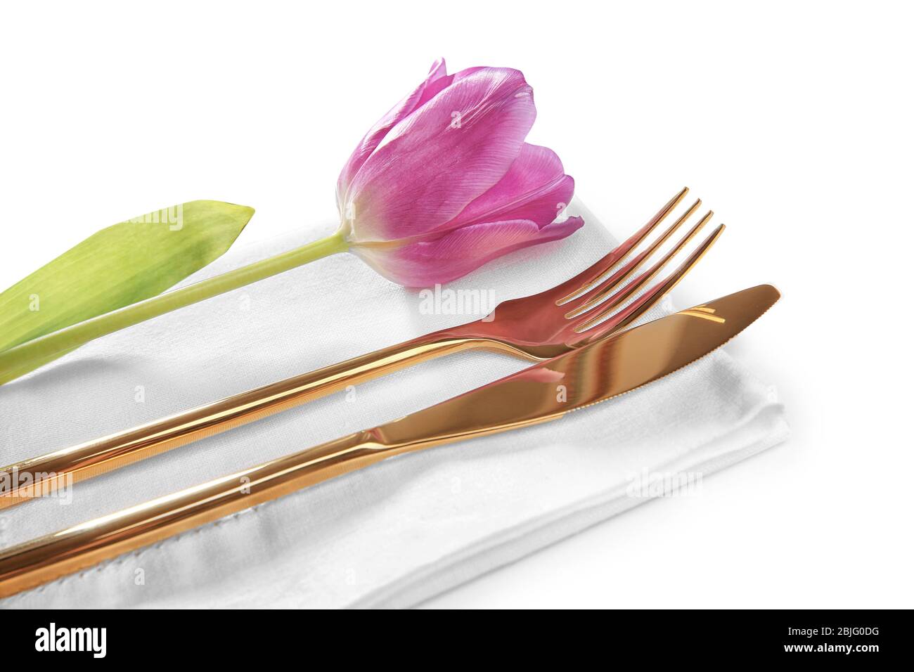 Cutlery set with beautiful flower on white background Stock Photo - Alamy