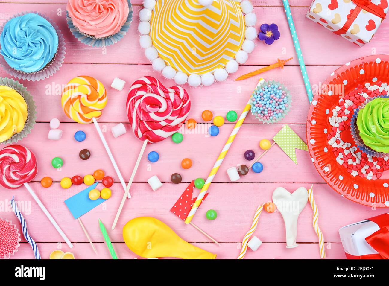 Bright birthday background with sweets and decorations Stock Photo - Alamy