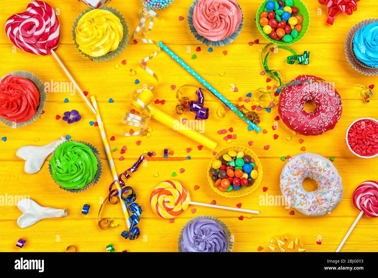 Bright birthday background with sweets and decorations Stock Photo - Alamy