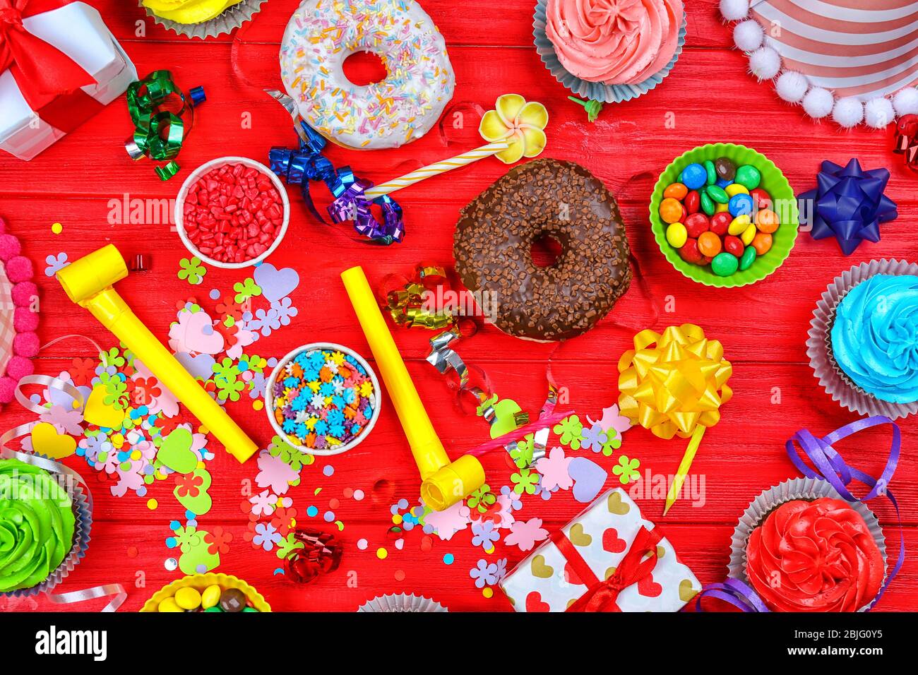 Bright birthday background with sweets and decorations Stock Photo - Alamy