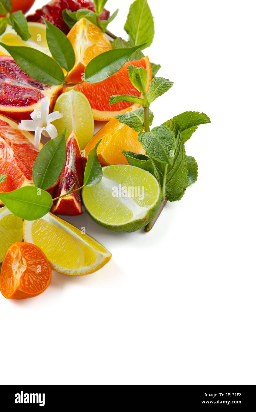 Composition of citrus fruits and green leaves on white background Stock ...