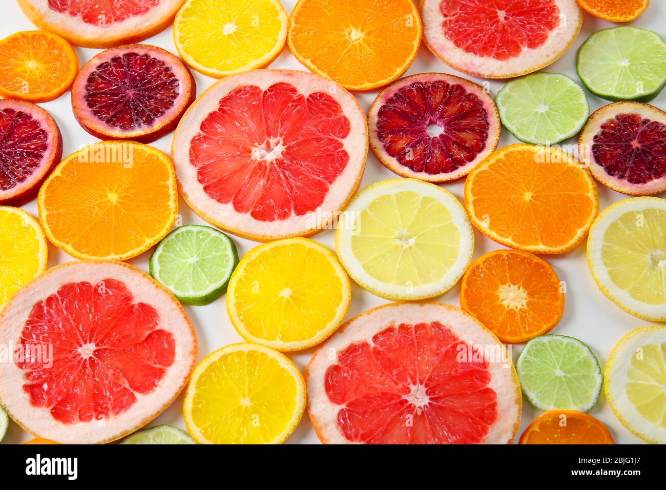Juicy slices of citrus fruits, closeup Stock Photo - Alamy