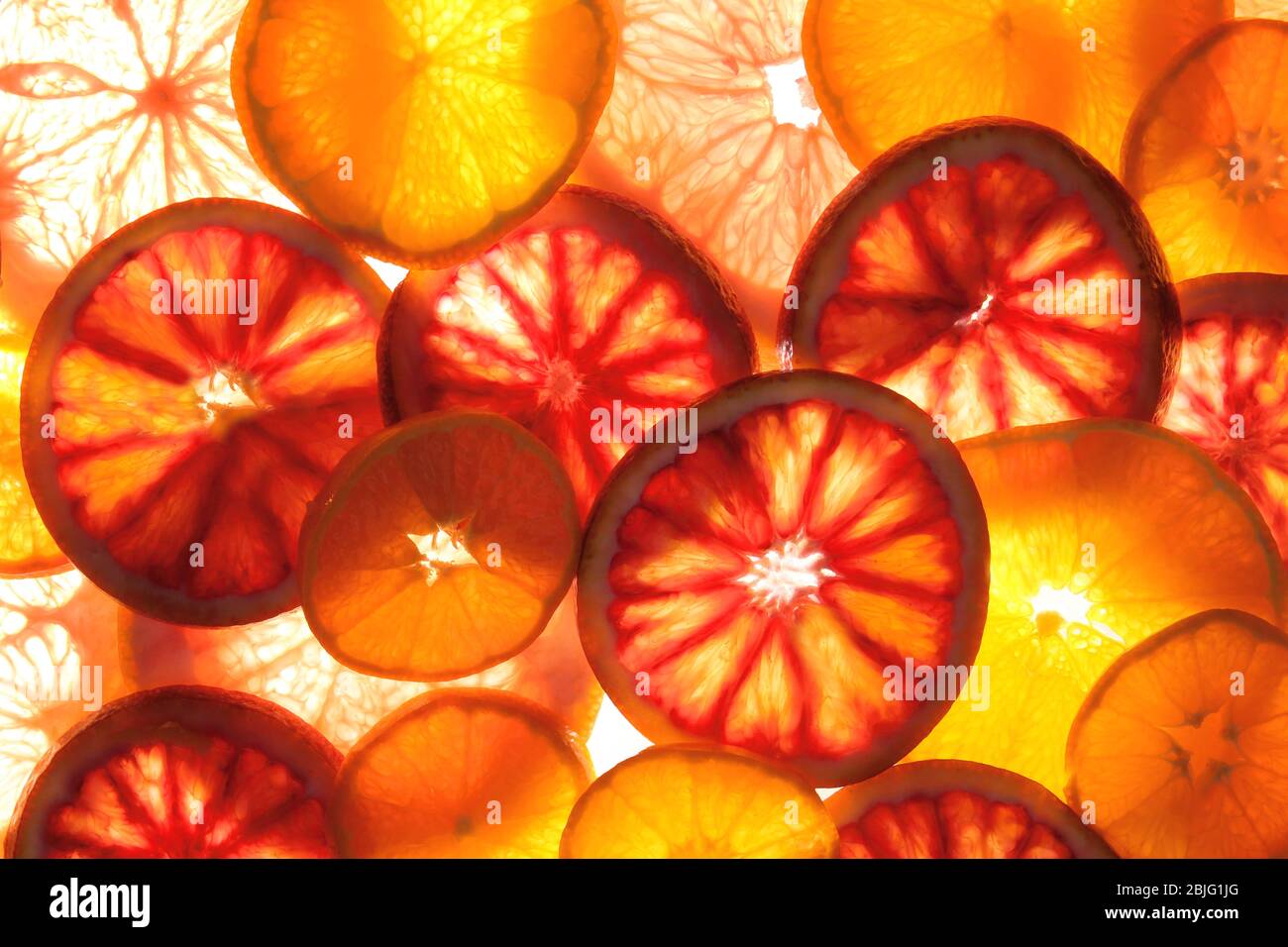 Slices of delicious juicy citrus fruits, closeup Stock Photo - Alamy