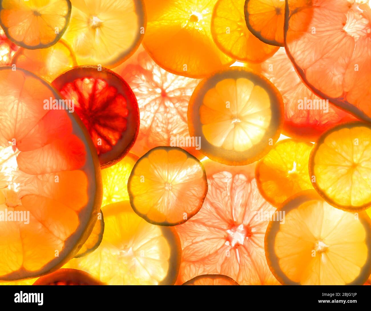 Slices of delicious juicy citrus fruits, closeup Stock Photo - Alamy