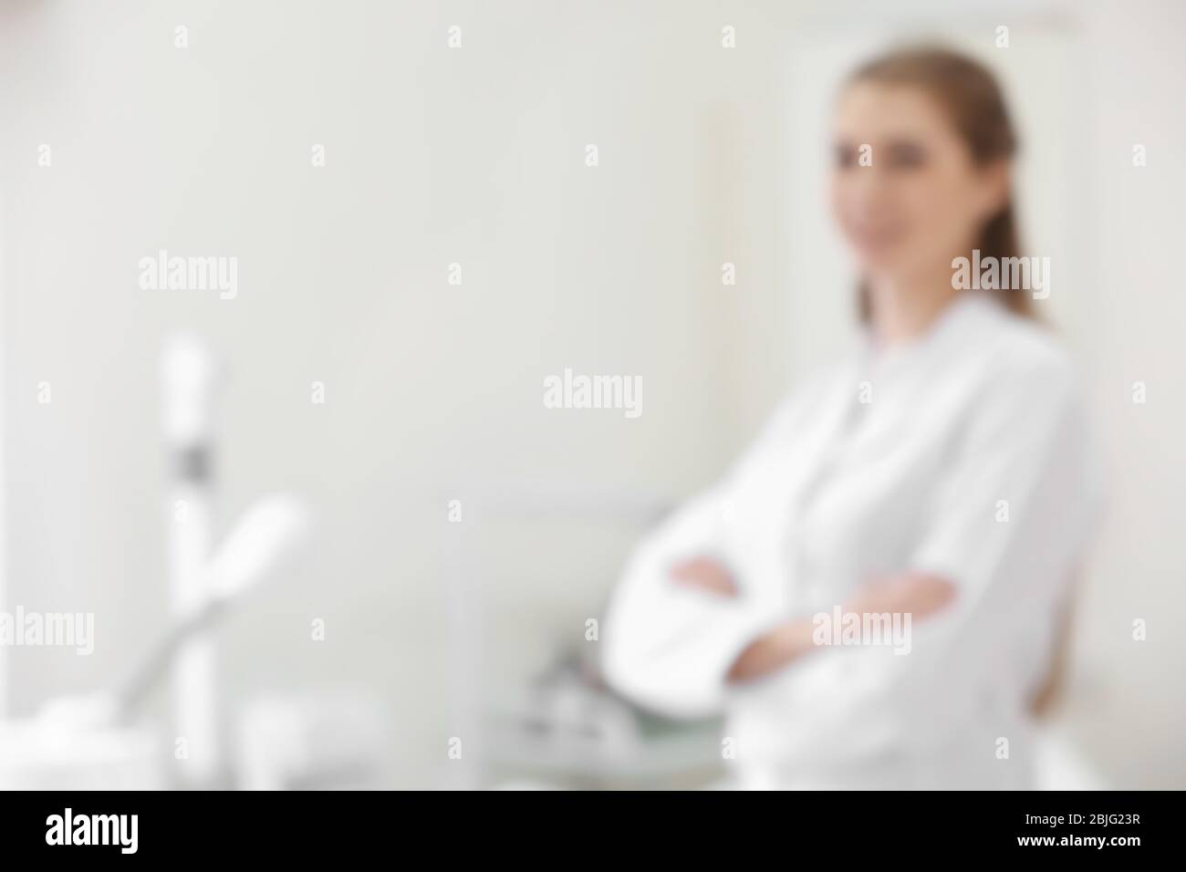Blurred view of young beautiful doctor in dermatology clinic Stock ...