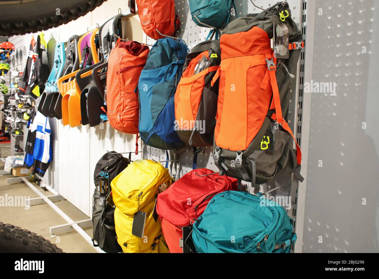 Backpacks on bicycle exhibition in showroom Stock Photo - Alamy