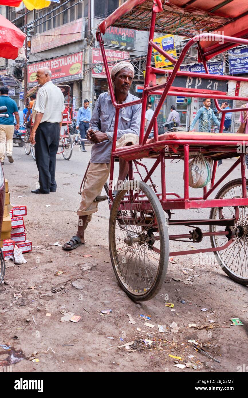 New Delhi / India - September 19, 2019: Poor rickshaw driver with his ...