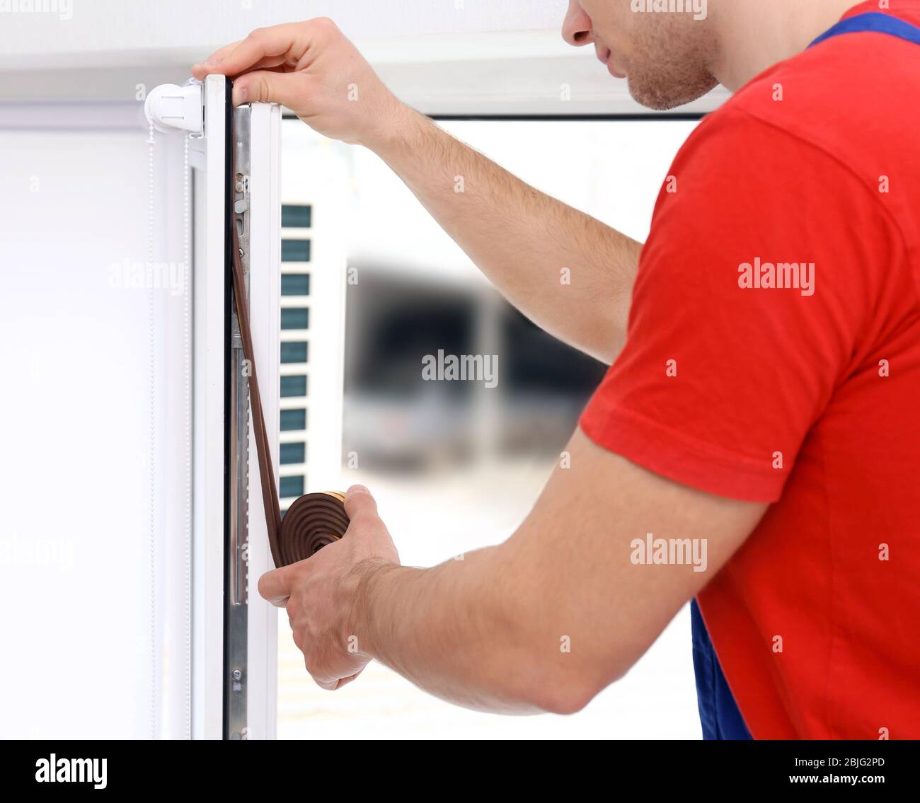 Applying rubber strip hi-res stock photography and images - Alamy