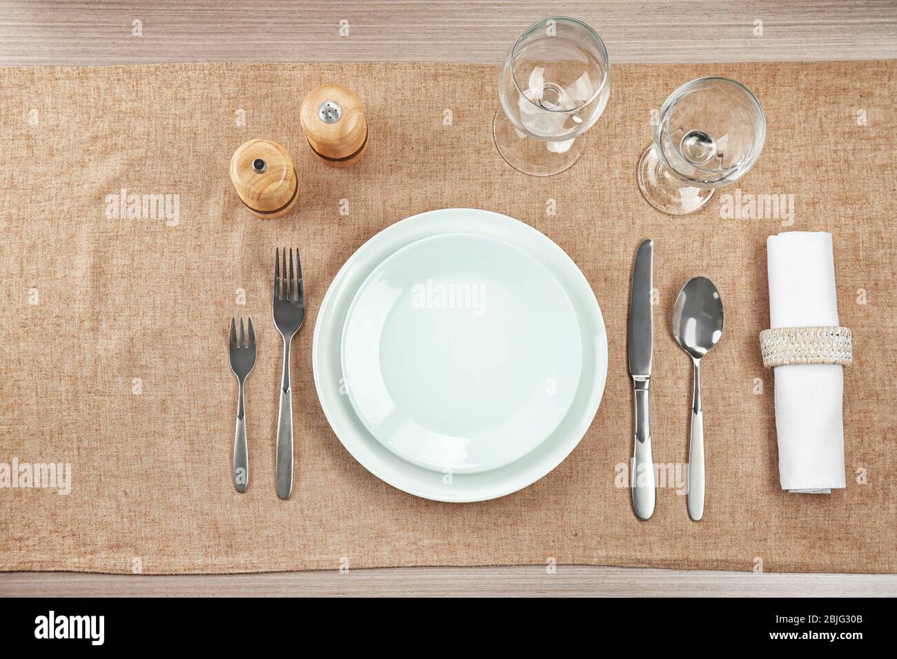Beautiful table setting with white plates Stock Photo - Alamy
