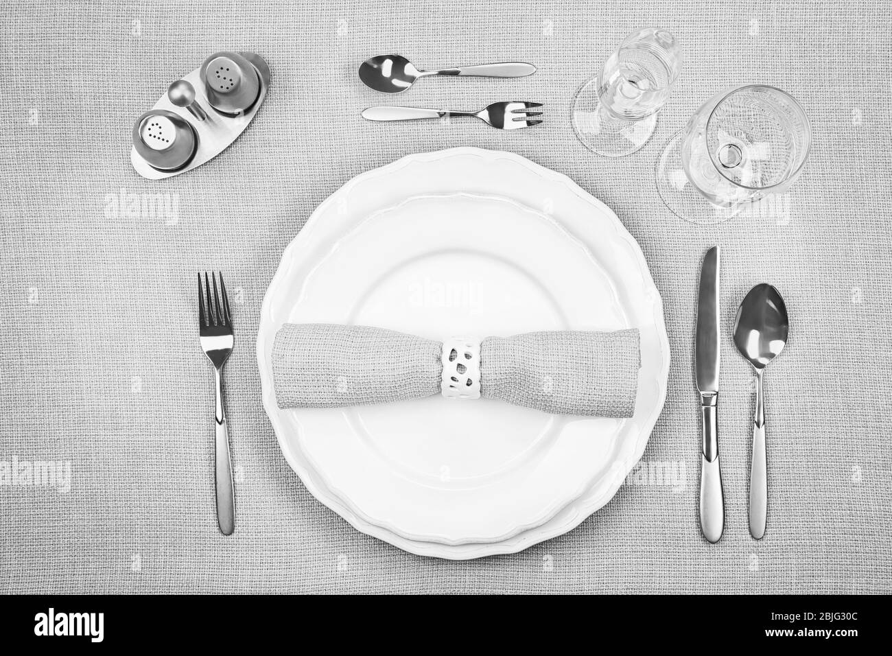 Beautiful table setting with white plates Stock Photo - Alamy
