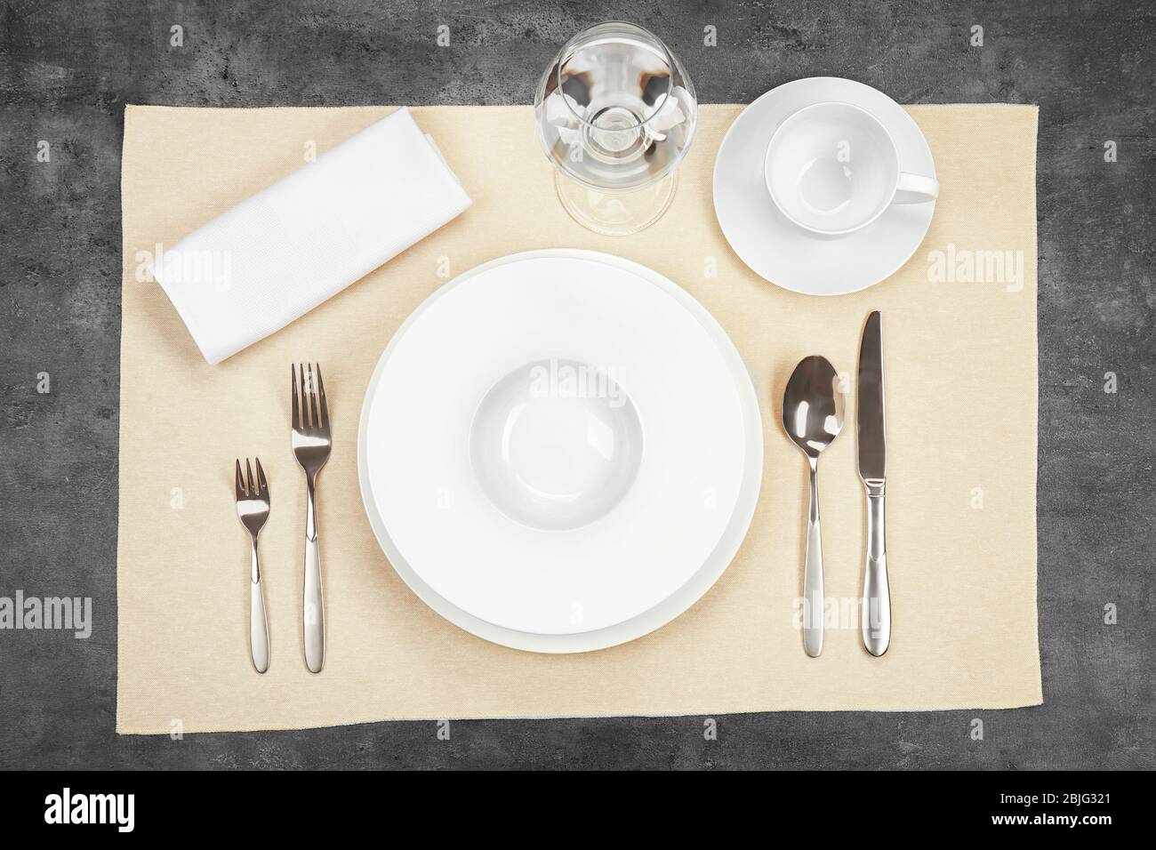 Beautiful table setting with white plates Stock Photo - Alamy