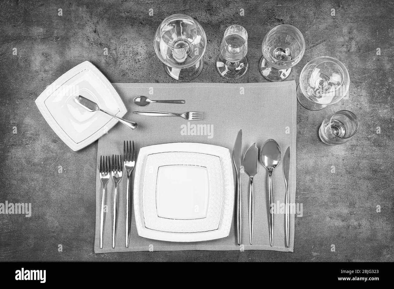 Beautiful table setting with white plates Stock Photo - Alamy