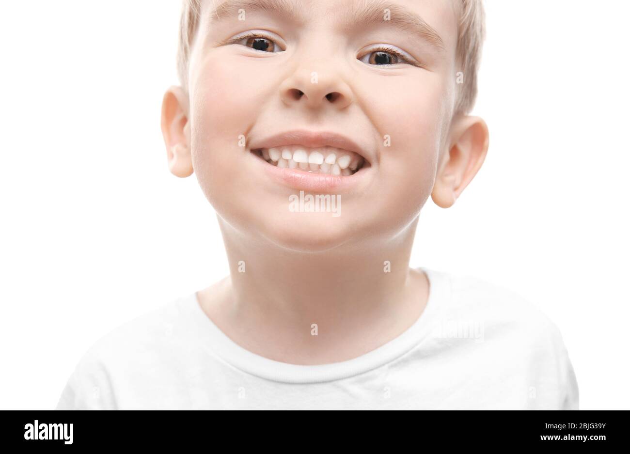 Cute little boy showing teeth on white background, close up Stock Photo ...