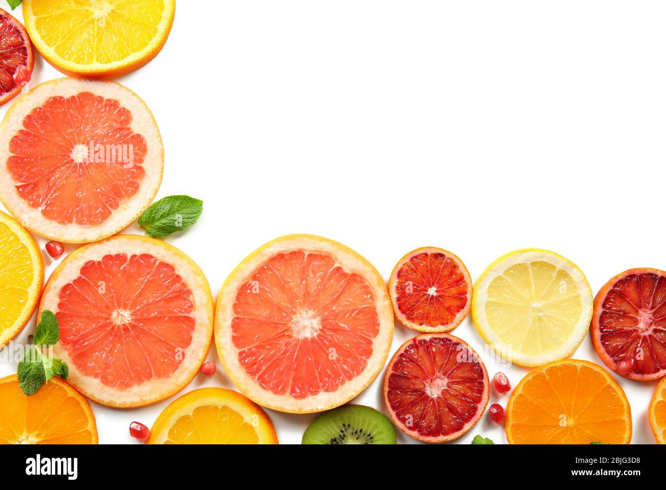 Citrus slices on white background Stock Photo - Alamy