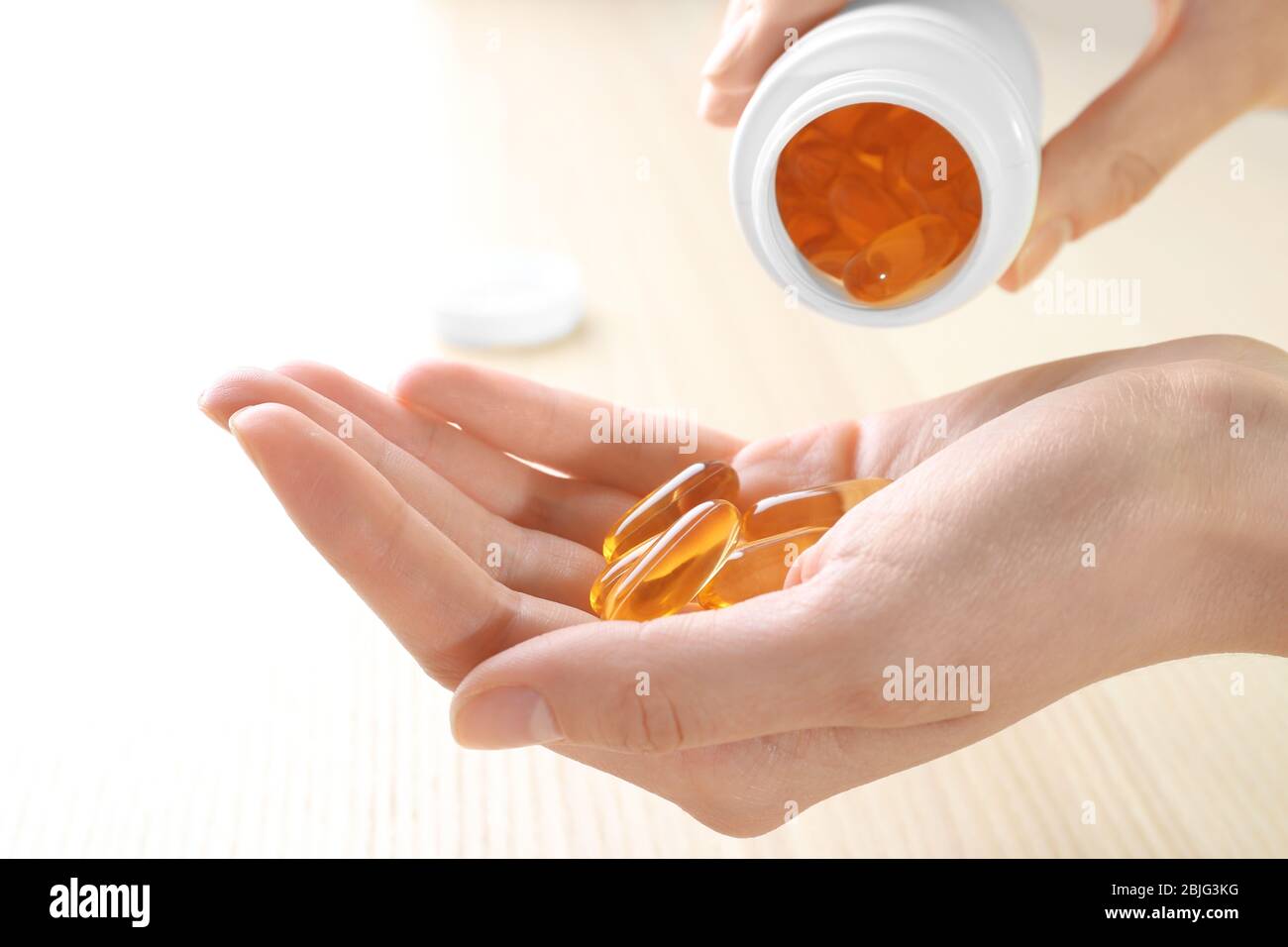 Close up woman pouring fish hi-res stock photography and images - Alamy