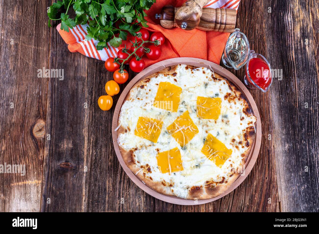 Four types of cheese (Four Cheese Pizza) Italian pizza on a wooden ...