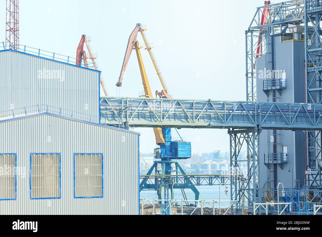 View of factory in sea port Stock Photo - Alamy