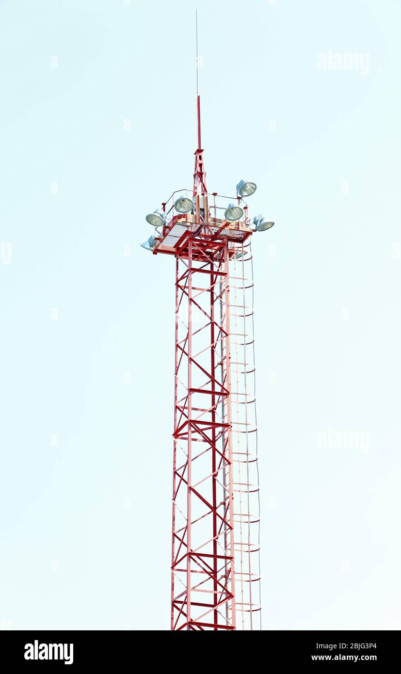 Iron tower with projector lamps on sky background Stock Photo - Alamy