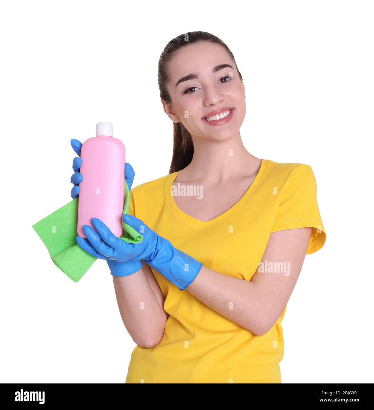 Beautiful young woman holding cleaning supplies for window on white ...