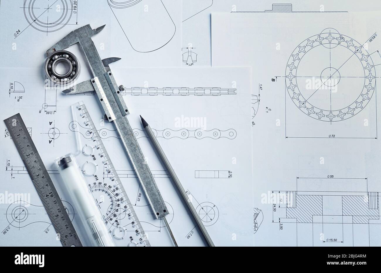 Engineering supplies and blueprints on workplace Stock Photo - Alamy