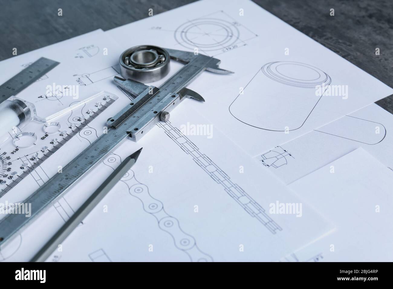 Engineering supplies and blueprints on workplace Stock Photo - Alamy