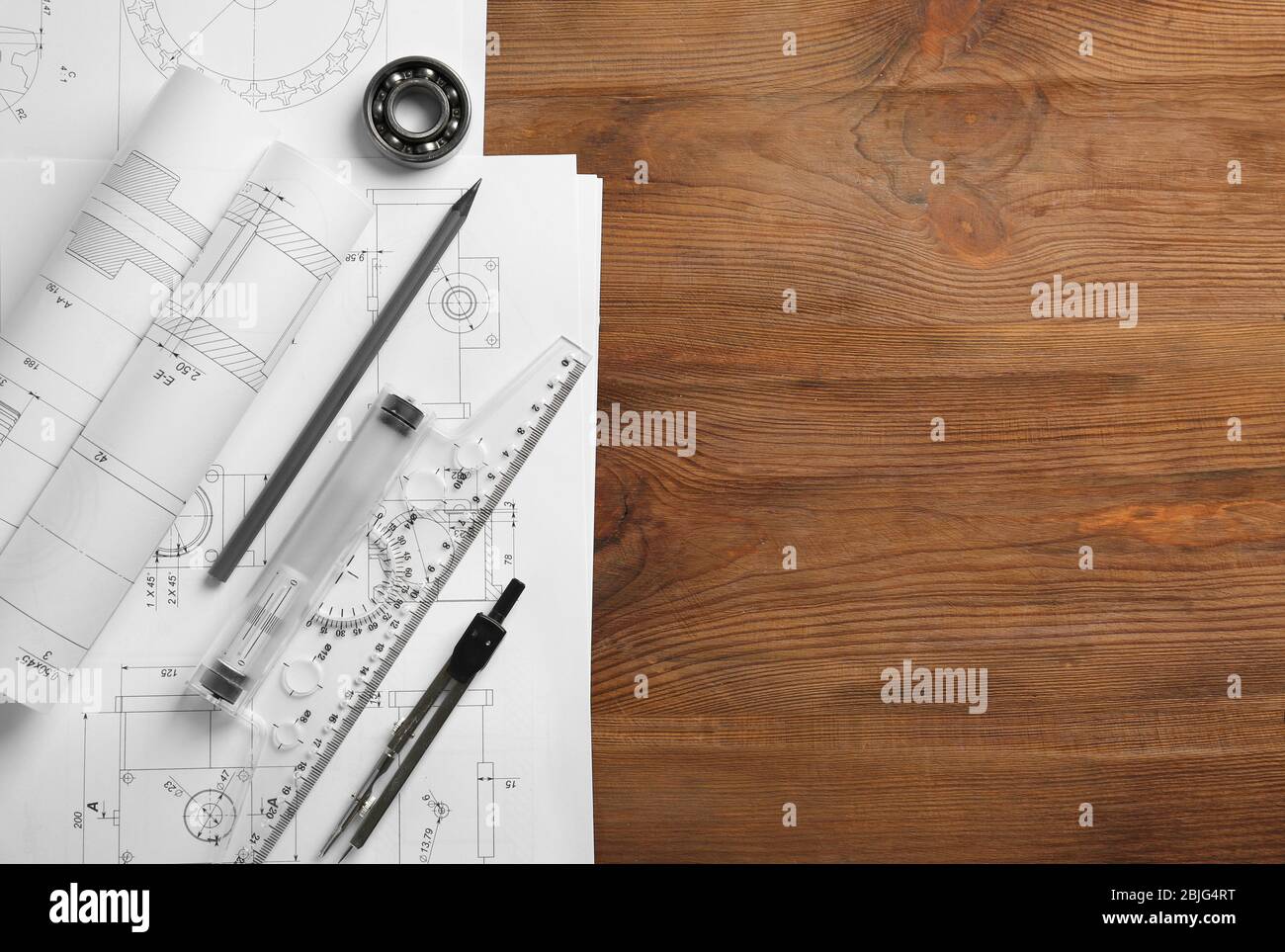 Engineering supplies and blueprints on workplace Stock Photo - Alamy