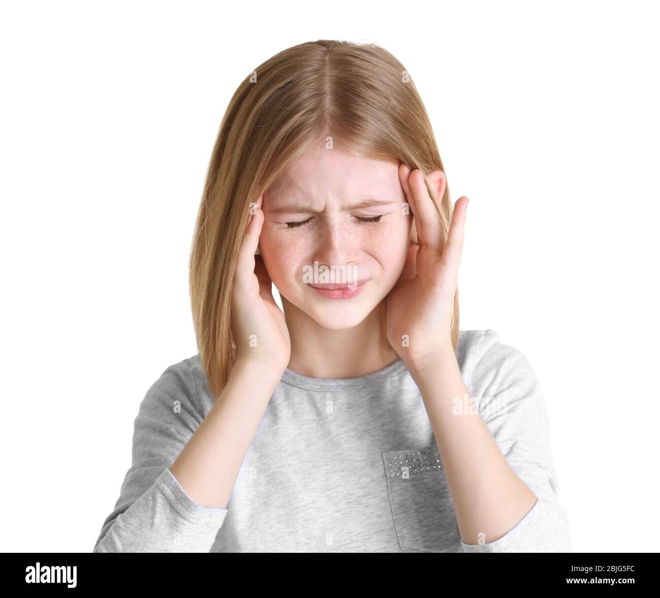 Cute girl suffering from headache on white background Stock Photo - Alamy